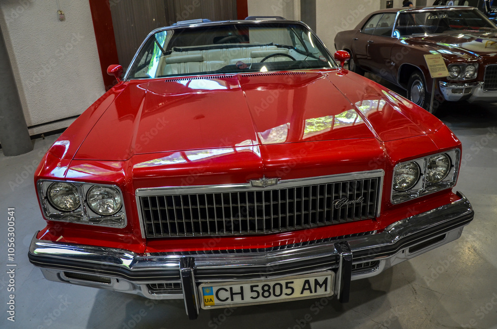 The red convertible Chevrolet Impala of the fifth generation is a ...