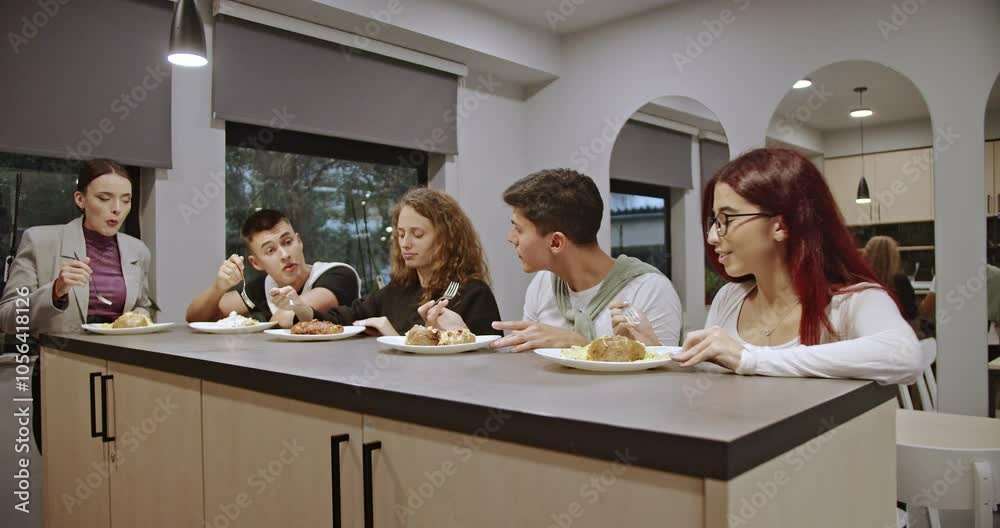A professor and students share a meal in the school cafeteria between ...