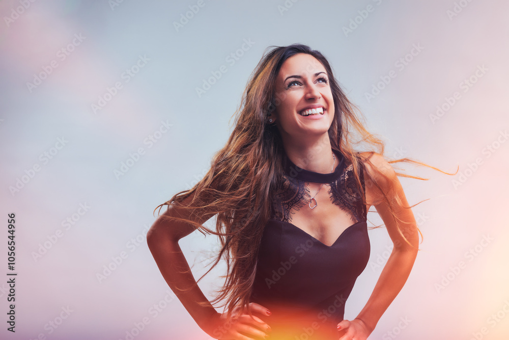Powerful woman smiling and posing with hands on hips, feeling co Stock ...
