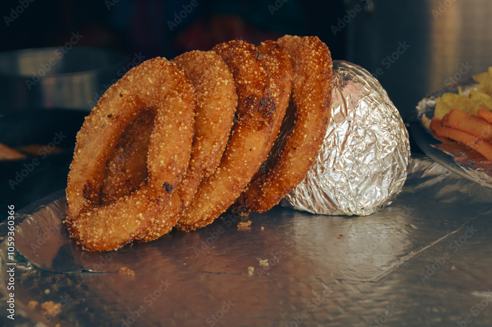 Sel roti which is a ring-shaped sweet fried dough made from rice flour ...