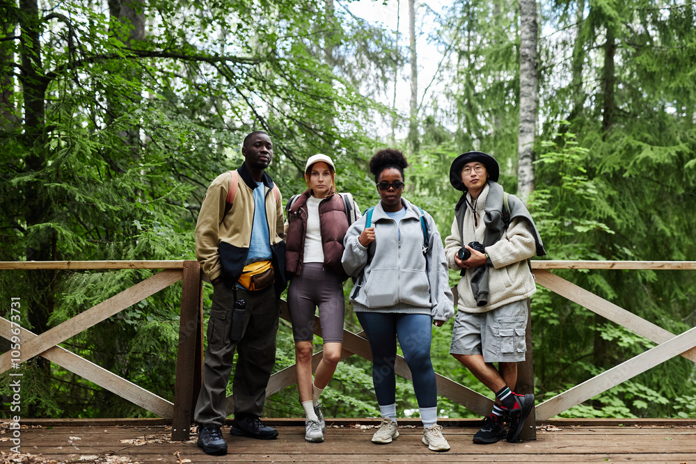 Full length portrait of multiethnic group of young people as tourists ...