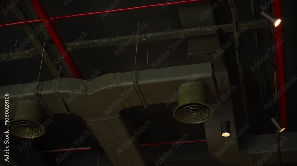 Close-up view of ductwork and pipes in an industrial-style ceiling ...