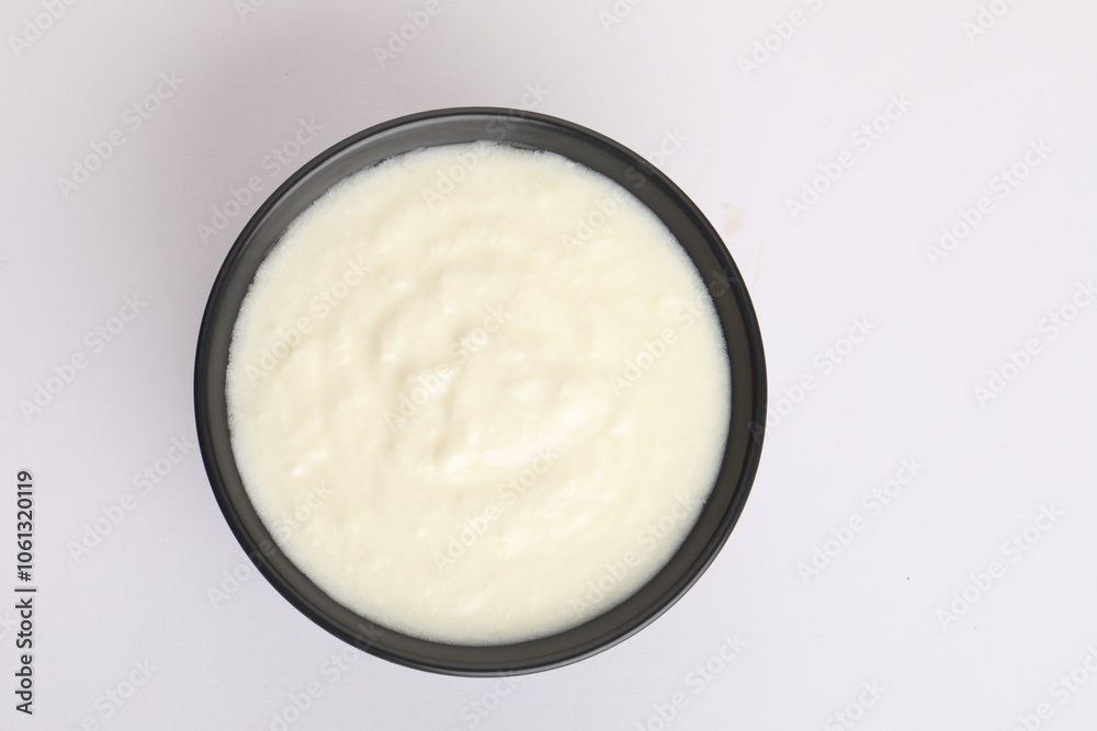 Homemade dahi doi or sour cream or curd or yogurt in a ceramic bowl ...