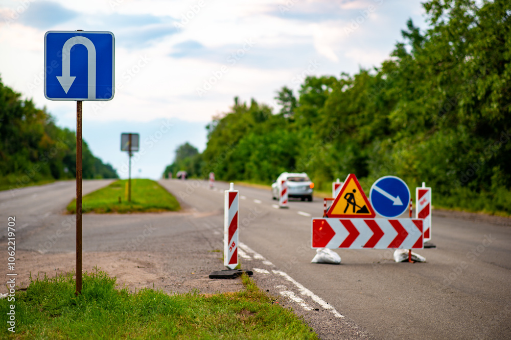 Road signs indicating construction work ahead, alerting drivers to ...