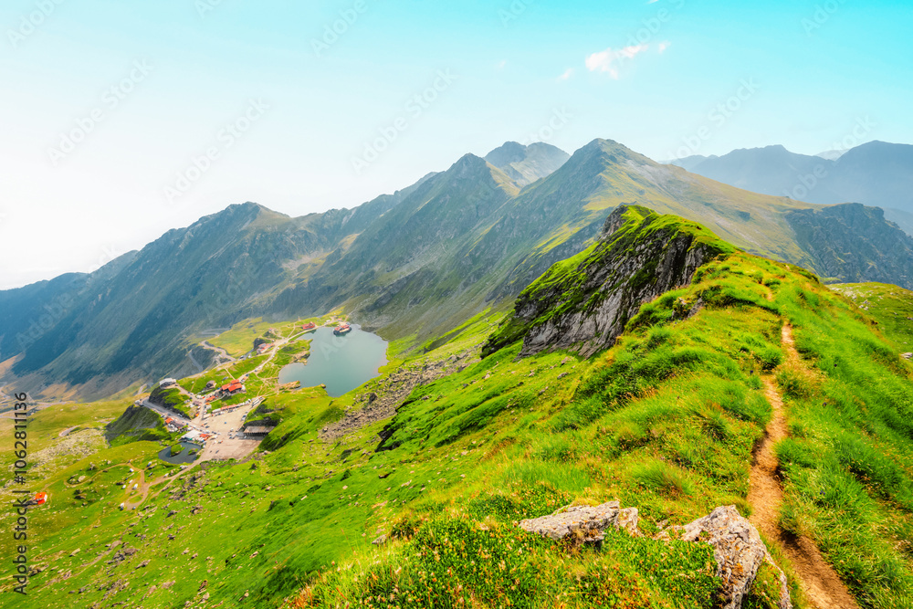 Hiking in Fagaras mountains on Iezerul Caprei peak over Transfagarasan ...