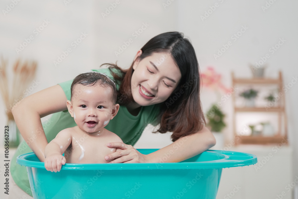 Young mom shower baby , Baby Asian happy moment with mom at living room ...