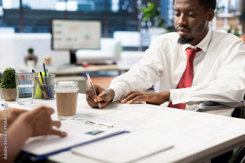 Human resources worker looking at candidate CV during job interview ...