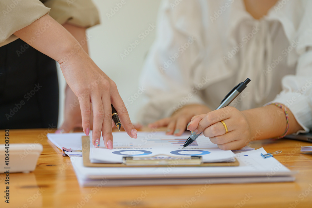 Young business team working with business report documents on office desk. Brainstorming ...