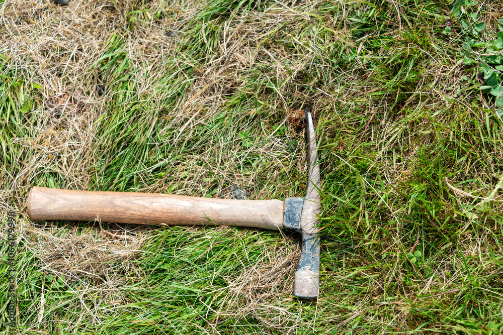 An archaeology trowel pick with a narrow, flat-bladed head is an ...