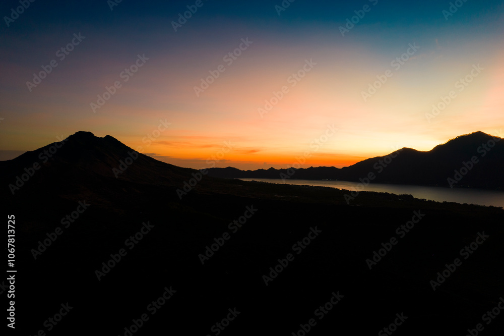 Sunrise view of Mount Batur , Kintamani Volcano located at the center ...