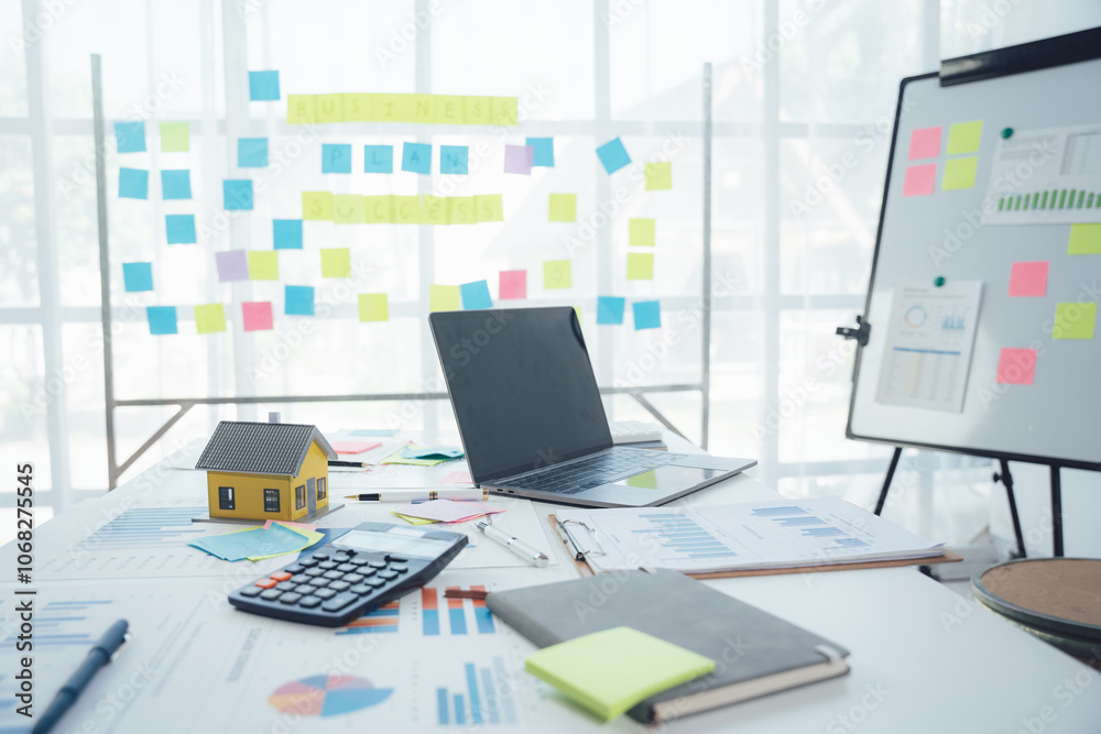 Modern Workspace: A well-organized desk with a laptop, calculator, and ...