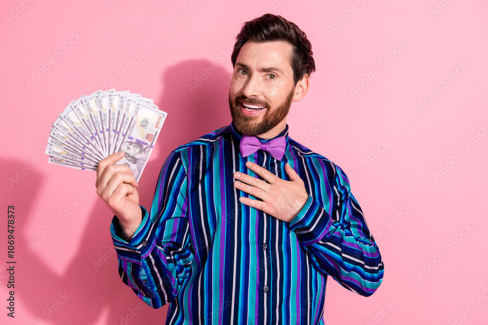 Photo of amazed glad rich man wear trendy clothes hand hold money cash ...