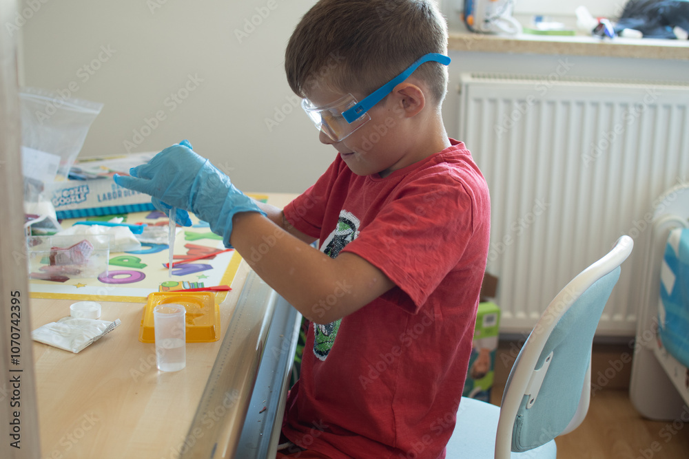 Looking for a picture of a young boy doing a science experiment ...