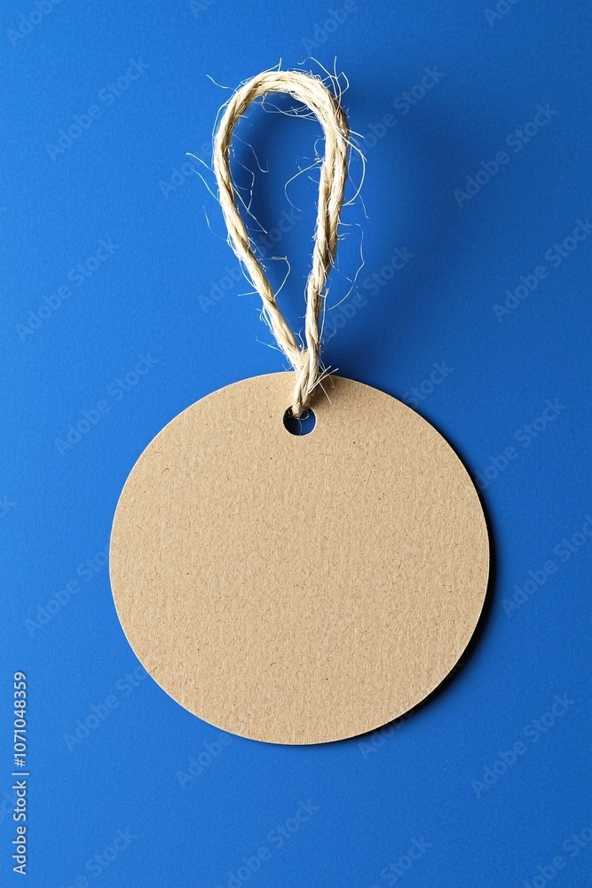 Blank circular tag on a solid blue background large space for branding ...