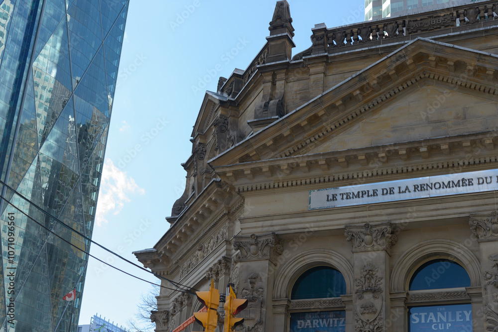 contrast of contemporary architecture (CIBC Square) and old bank branch ...