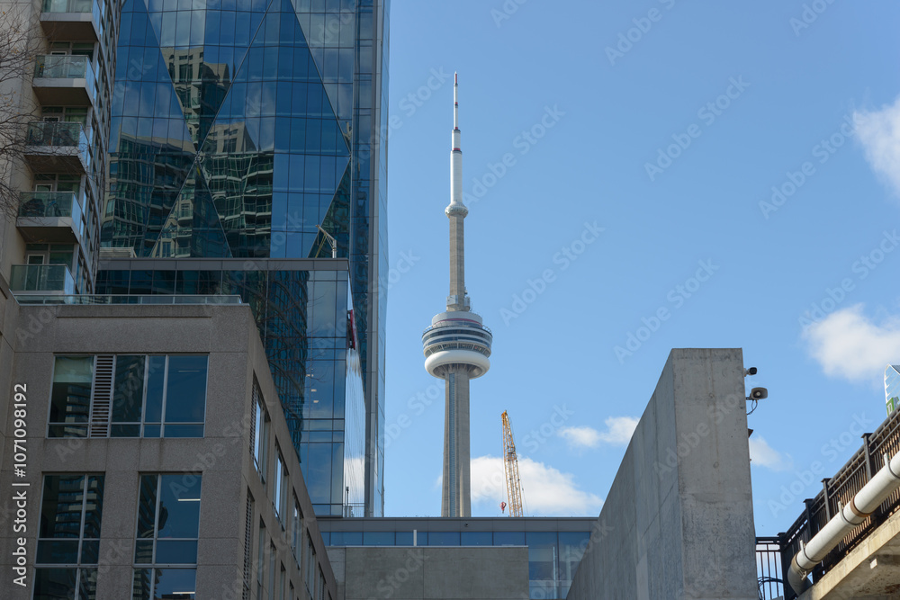 view of the CN tower with recently constructed office tower at left and ...