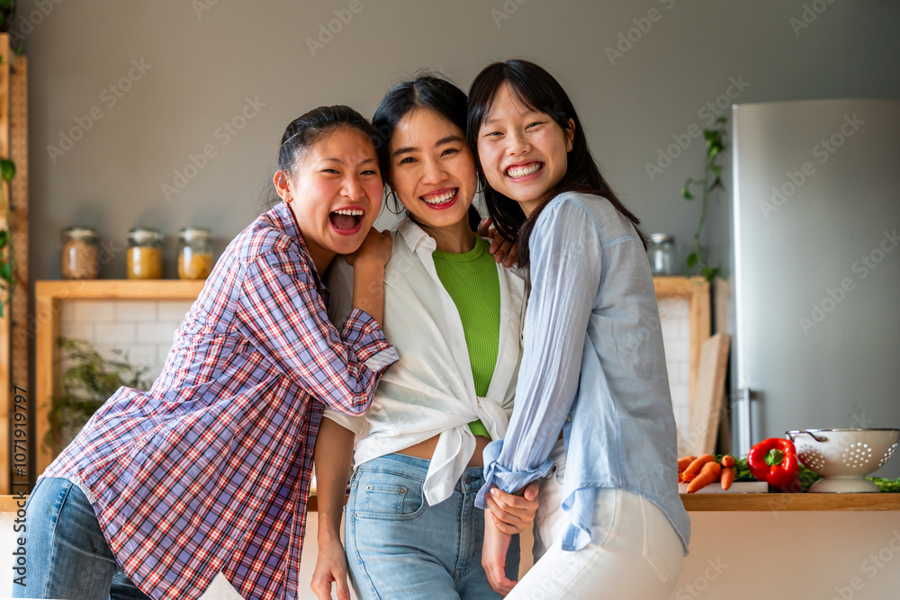 Happy beautiful chinese women friends bonding at home - Playful pretty ...