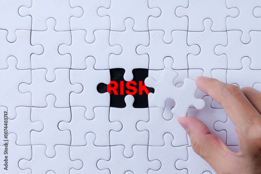 Risk Management and Identification Concept. A hand places a puzzle ...