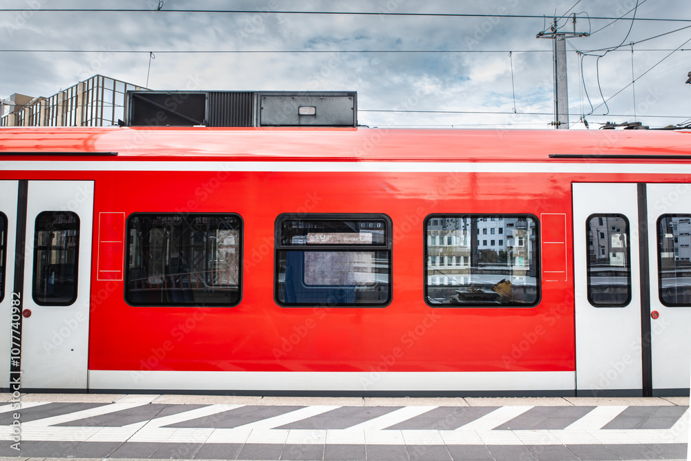 A German S-Bahn train at a suburban station platform, highlighting the ...