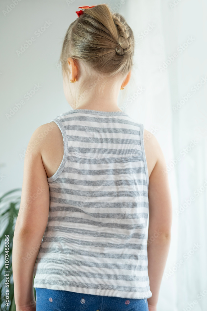 five-year-old child, young girl stands with back straight, showcasing ...