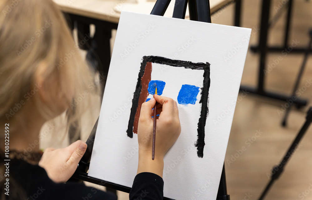 Children paint pictures with paints during additional didactic painting ...