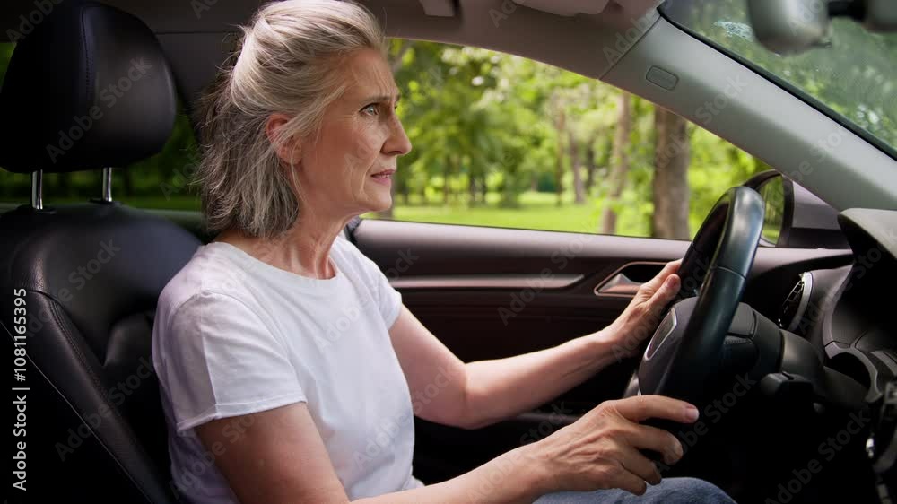 Annoyed irritated mad Caucasian mature senior elderly woman female auto ...