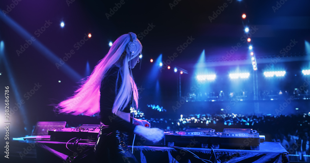 Back View of Female DJ with Long Blonde Hair Performing Live at a Night ...