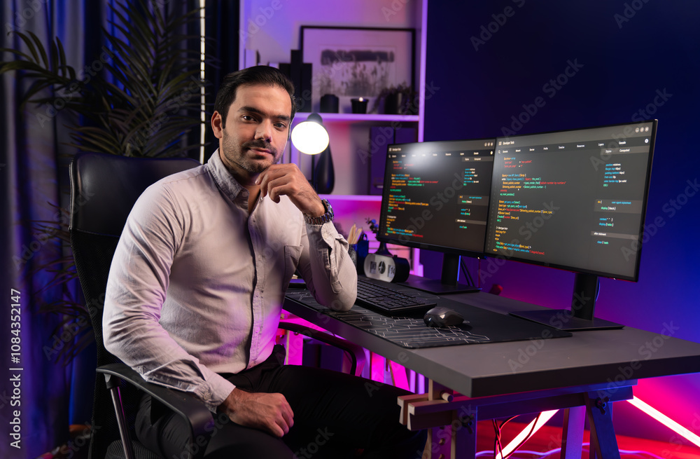 Profile's smart IT developer looking camera to pose with against on ...