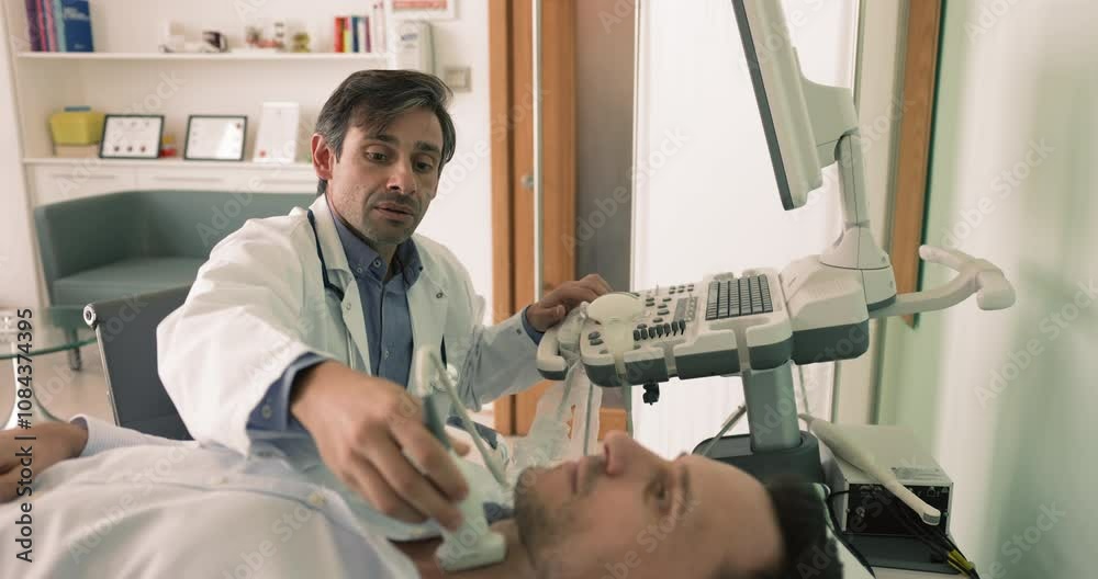 Mature endocrinologist check male patient thyroid gland using ...