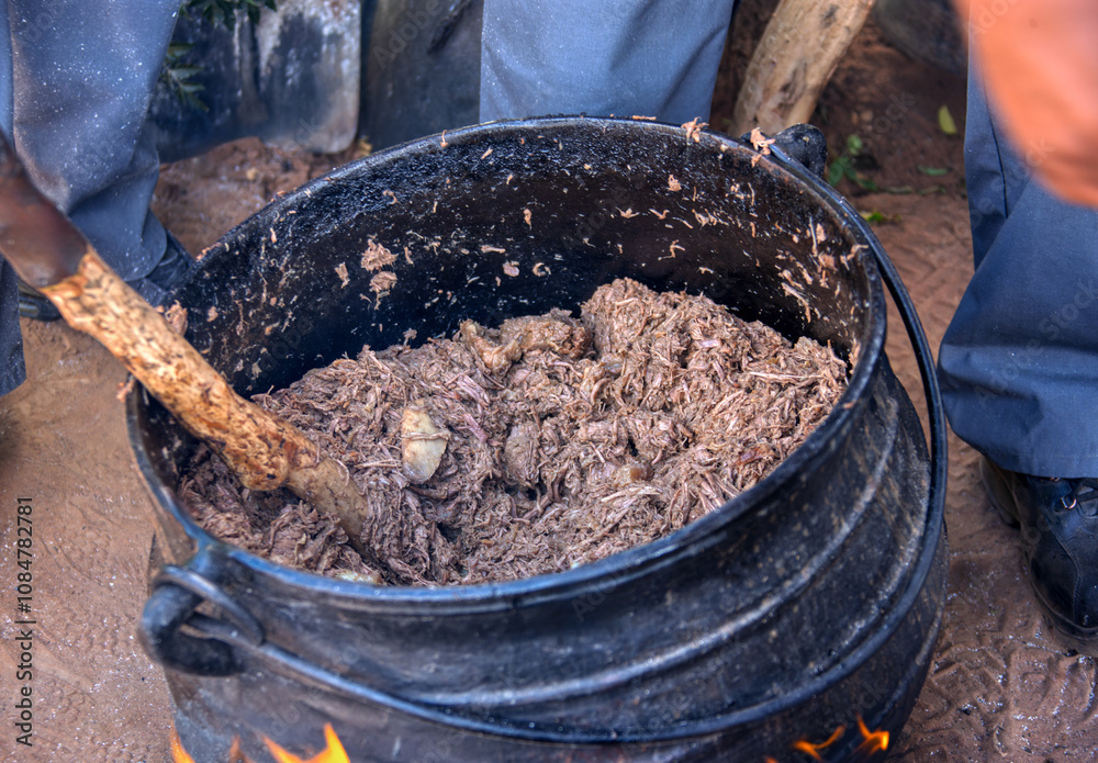 tswana people cooking traditional food setswa in a three legged pot ...