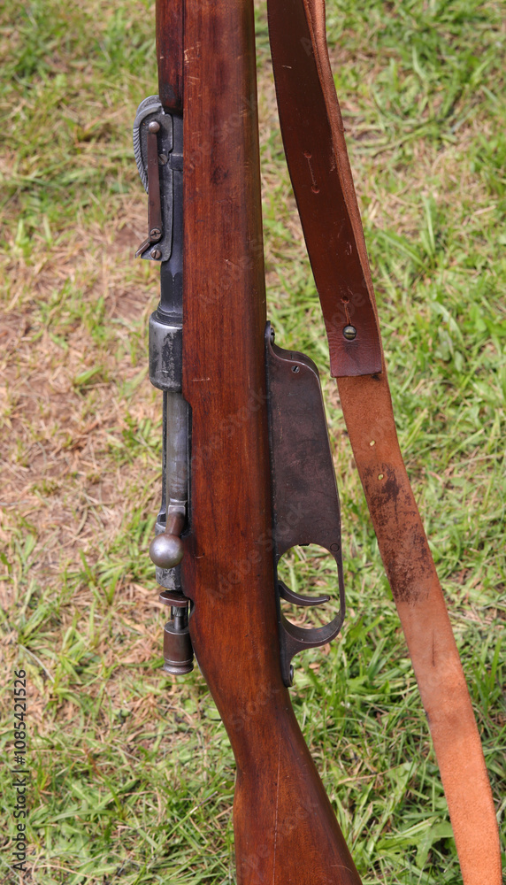old rifle made of metal and wood, used by the army during the first ...