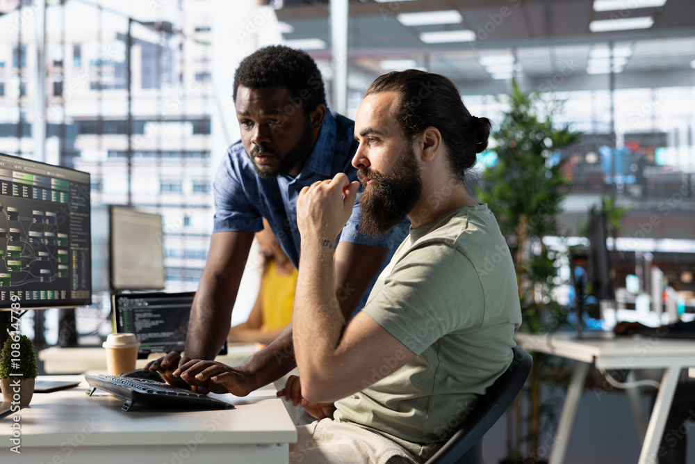 Developer requesting help from colleague while working with machine learning tech advancing AI ...