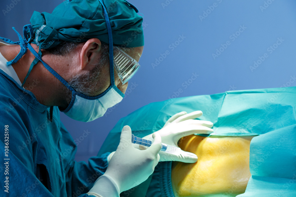 Spinal anesthesia injections. Surgical doctor cleaning with anti septic ...