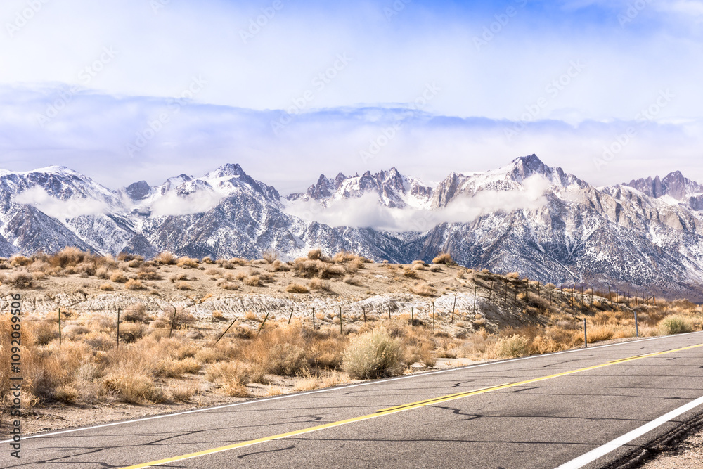 Snow dusting Mt. Whitney in the Sierra Nevada Range with low cloud bank ...