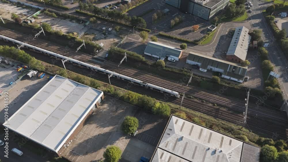 Elizabeth line train traveling through the Slough industrial estate ...