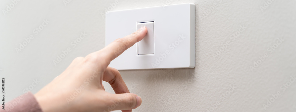 Save energy concept, Close-up finger of people turning off the ...