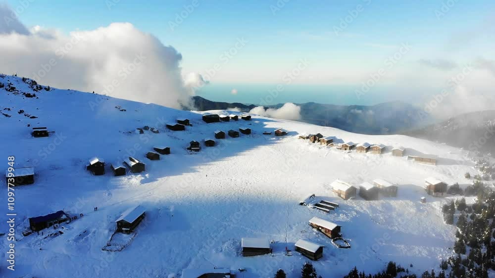 Wooden highland houses covered with snow. Footage of Sal plateau, which ...