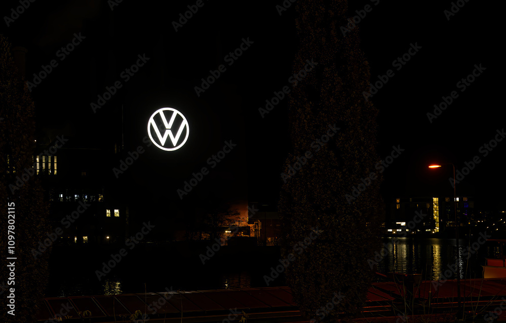 VW Volkswagen illuminated label at the power station of VW plant in ...