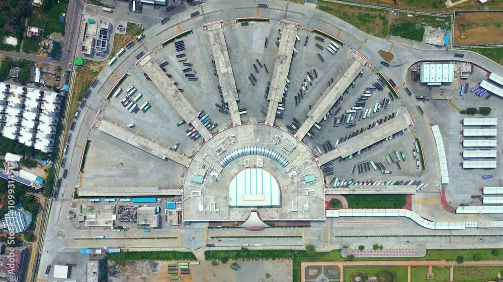 A top-down aerial view of the vast Kalaignar Centenary Bus Terminal in ...