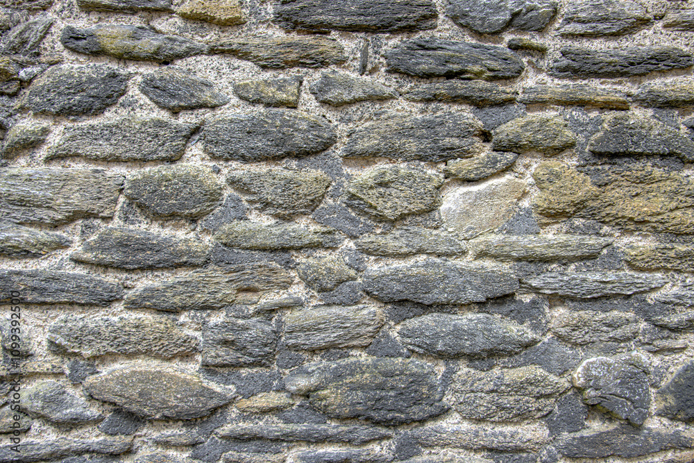 A timeless Breton wall built with old Breton rubble stones showcases ...