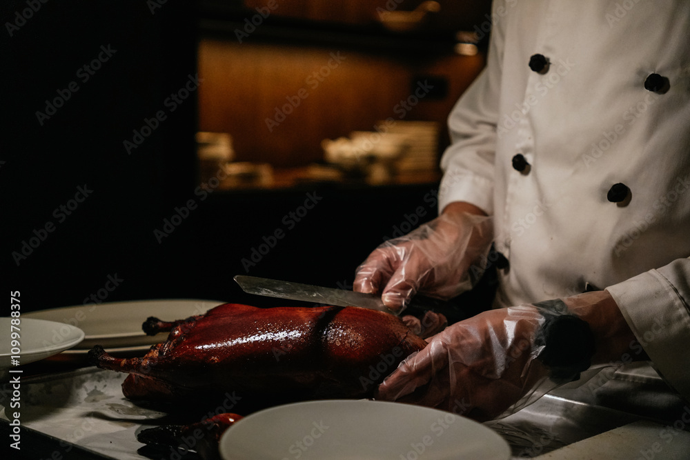 Chef cutting and serving roasted Beijing duck in luxury restaurant of ...