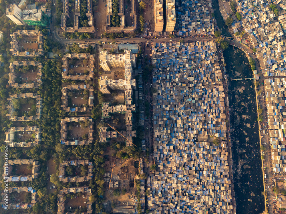 Aerial view of densely populated slums and buildings in a vibrant urban neighborhood, Dharavi ...