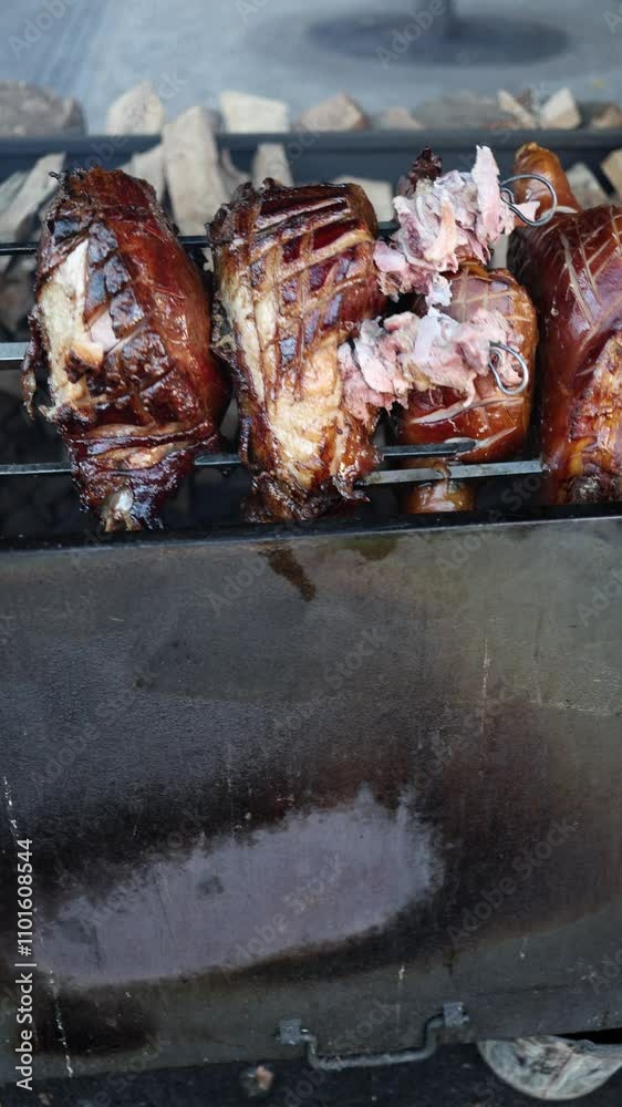 Juicy roasted meat spinning on a rotisserie grill, showcasing its ...