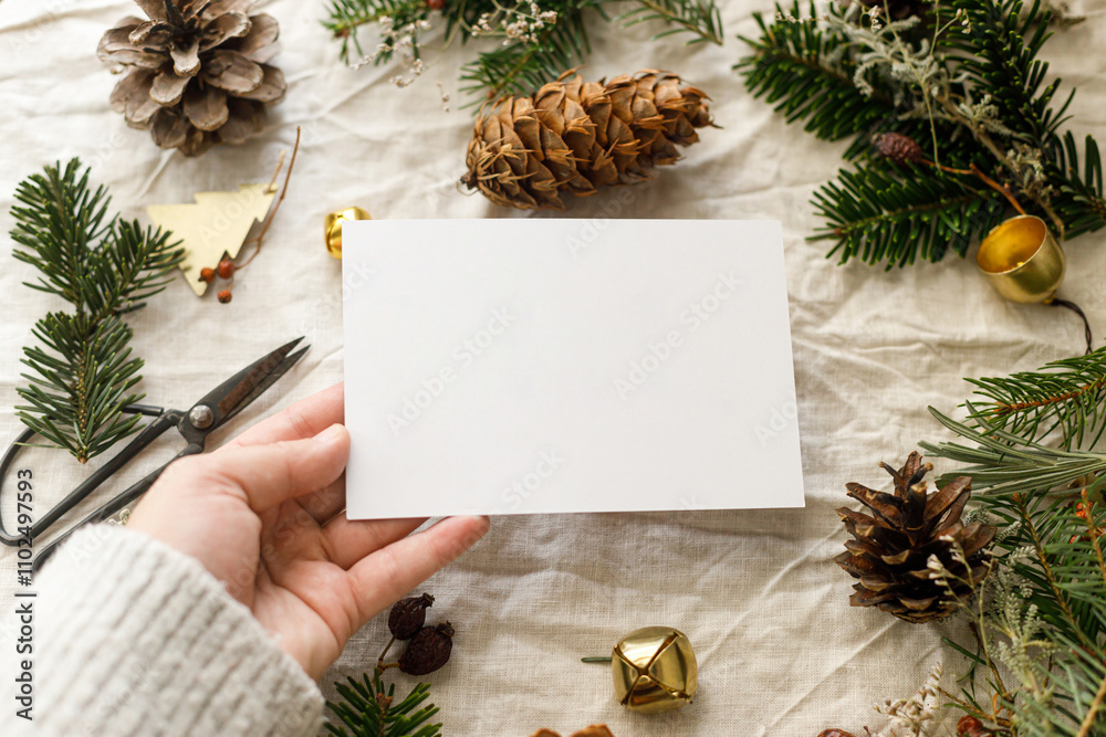 Christmas card mock up. Hand holding empty greeting card on rustic ...