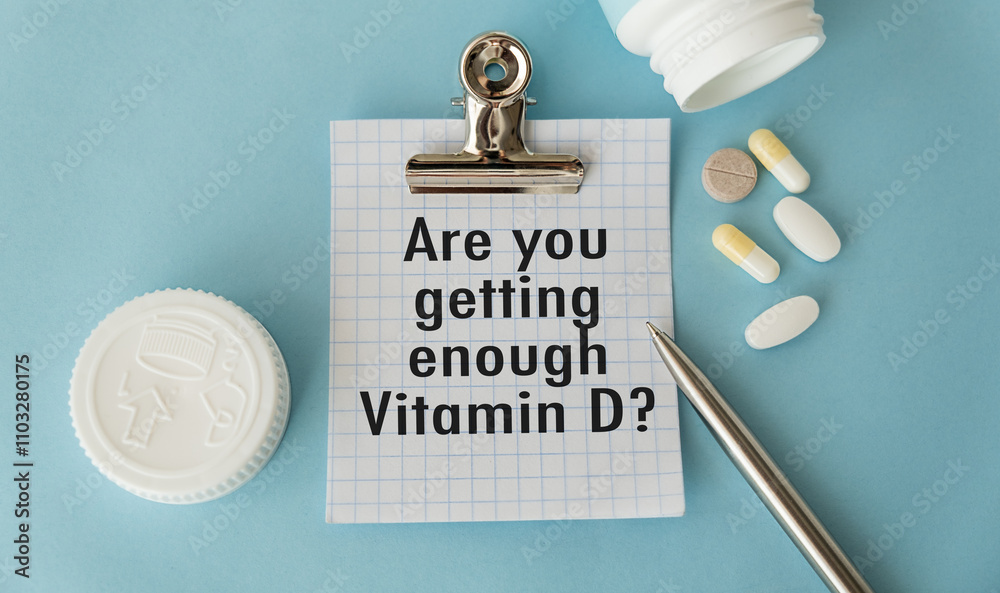 Are you getting enough vitamin d3 text on paper with pen and pills on ...