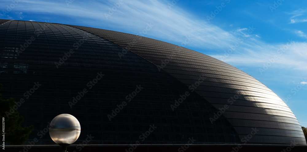 modern dome architecture under vibrant blue sky with streaks of white ...