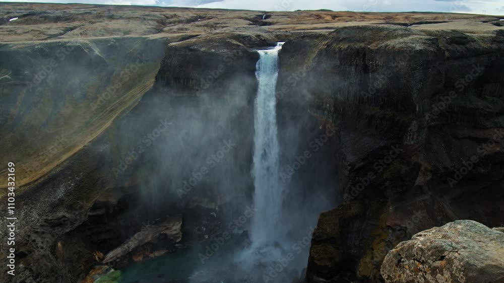 Dramatic waterfall in a remote location near a volcano. Icelandic ...