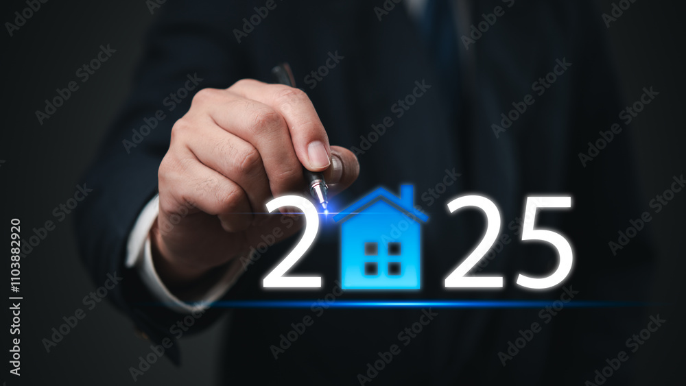 Businessman pointing at 2025 with a glowing house icon representing ...
