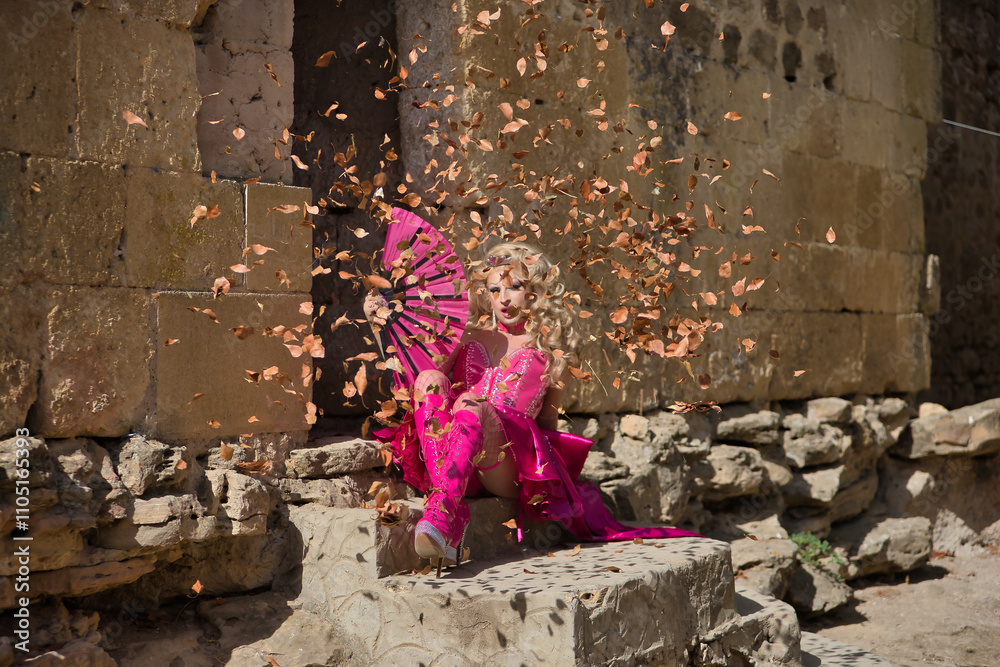 Drag queen, blonde, attractive, with crown, in pink dress and heeled ...