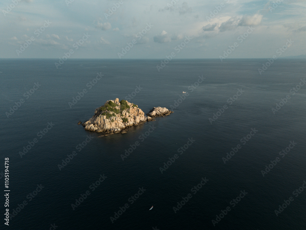 Aerial image of Isolated rock island on the middle of the ocean at ...